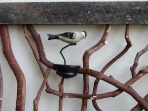 Barnwood Railing Featuring Hand-Carved Birds for Rustic Charm